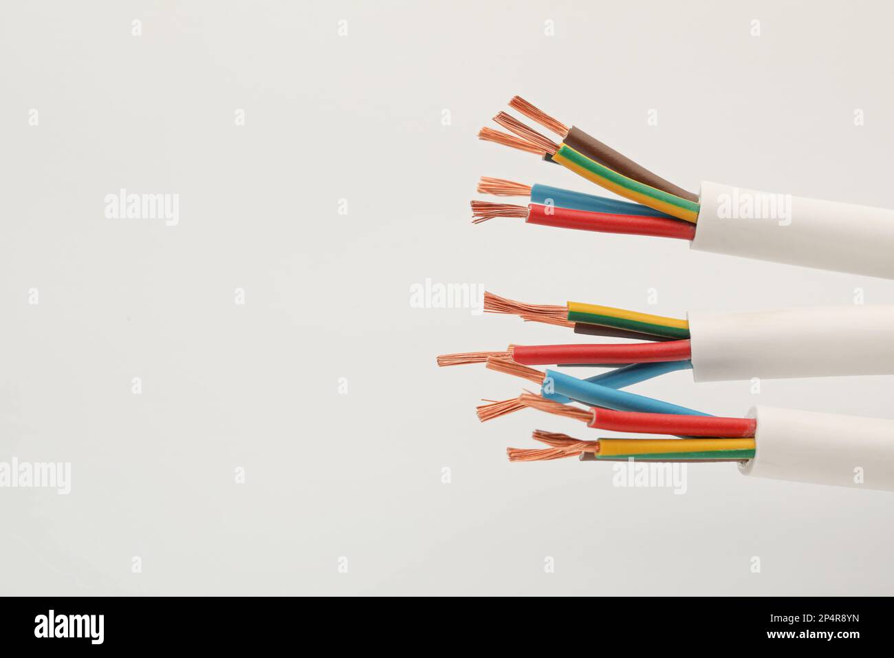 Electrical wires on white background, closeup view Stock Photo - Alamy