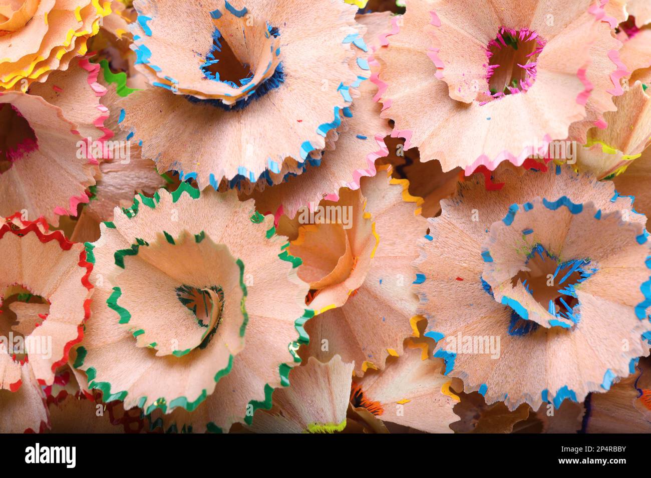 Pile of colorful pencil shavings as background, top view Stock Photo ...