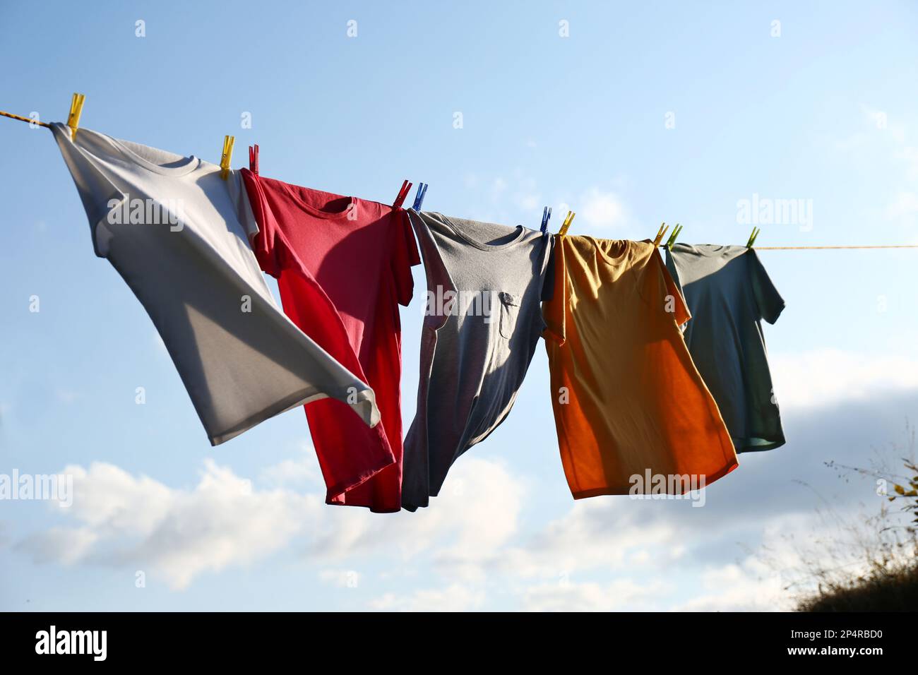 Clothesline clothes clouds sky hi-res stock photography and images - Alamy