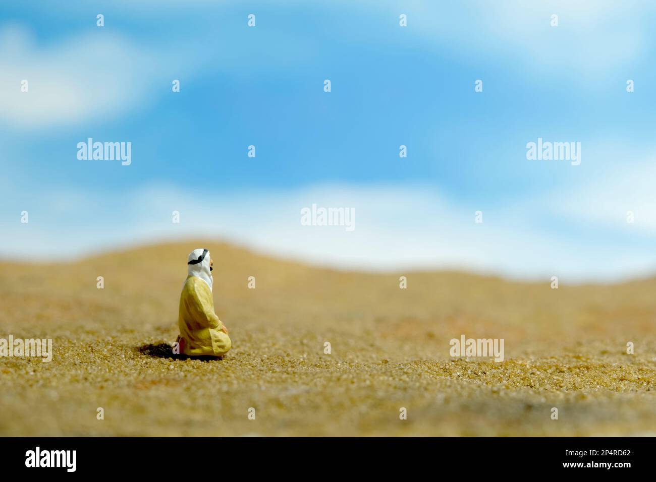 Miniature people toy figure photography. Middle eastern man wearing ...