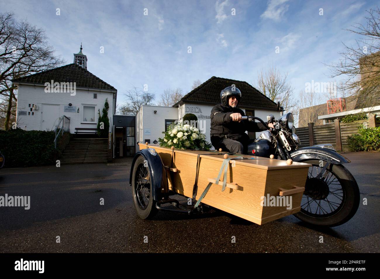 The casket of Ad van Antwerpen takes the last ride on a Harley Davidson ...