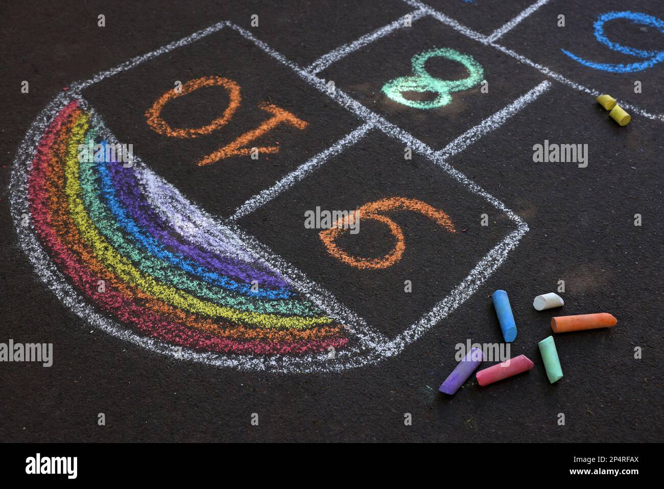 Hopscotch drawn with colorful chalk on asphalt outdoors Stock Photo - Alamy