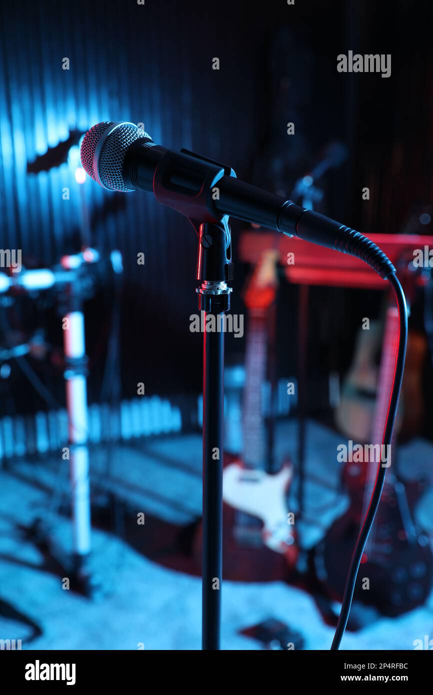Modern microphone at recording studio, color toned. Music band practice ...