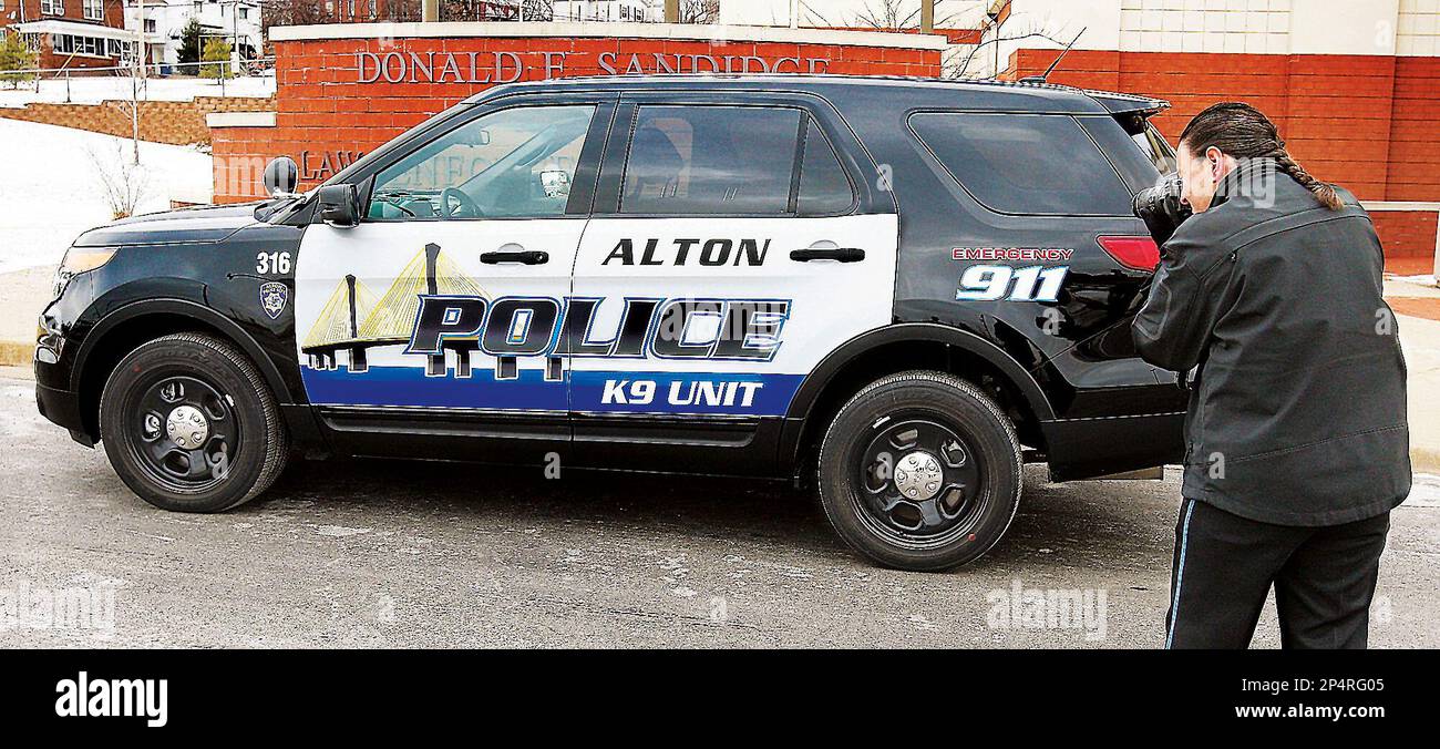 Officer Emily Hejna, of the Alton, Ill., Police Department, takes ...