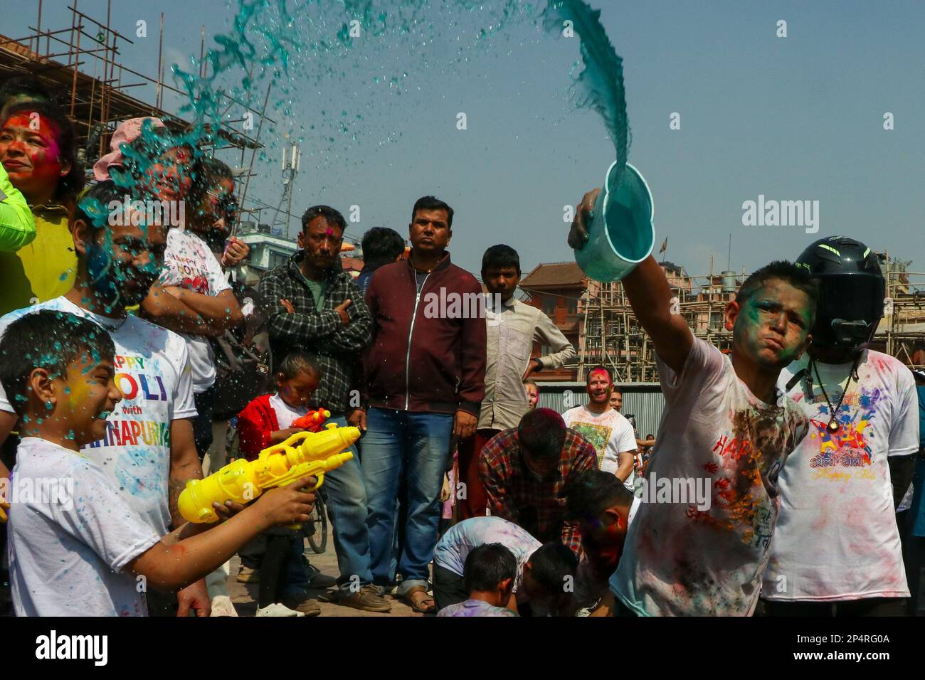 On March 6, 2023 in Kathmandu, Nepal. Young boys smeared in colour ...