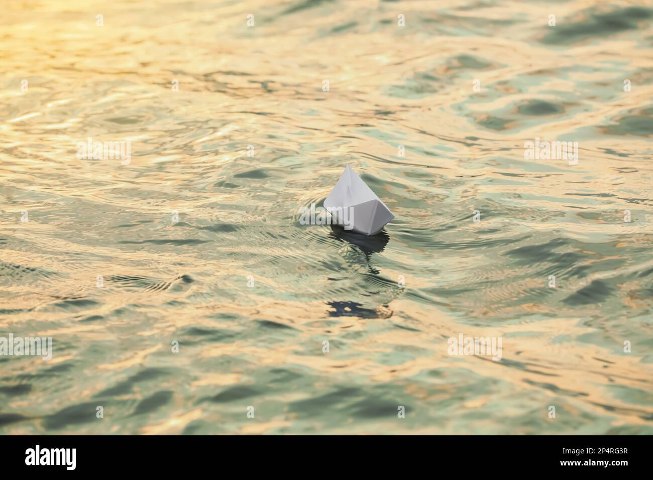 Paper boat floating on water outdoors. Space for text Stock Photo - Alamy