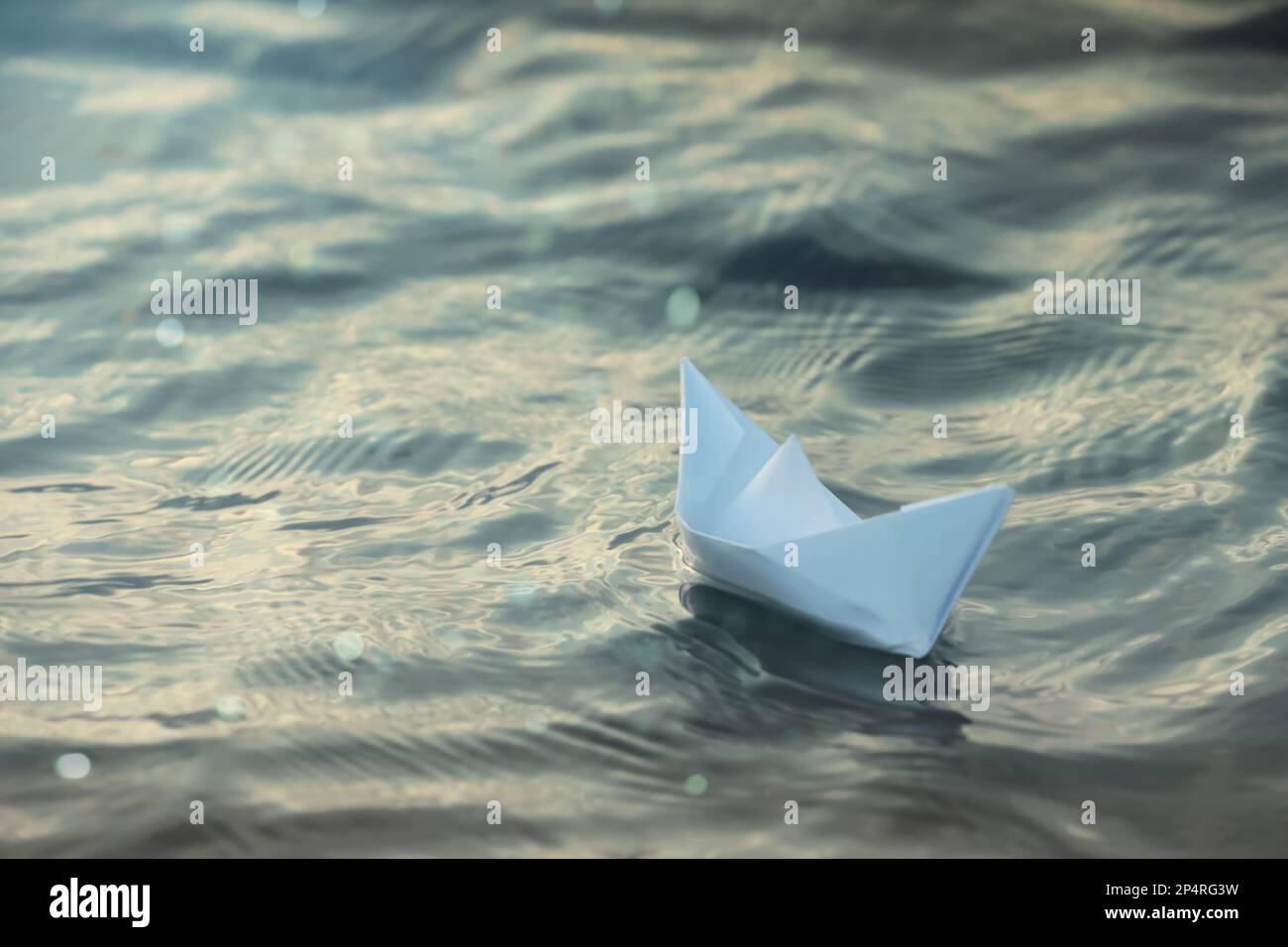 Paper boat floating on water outdoors. Space for text Stock Photo - Alamy