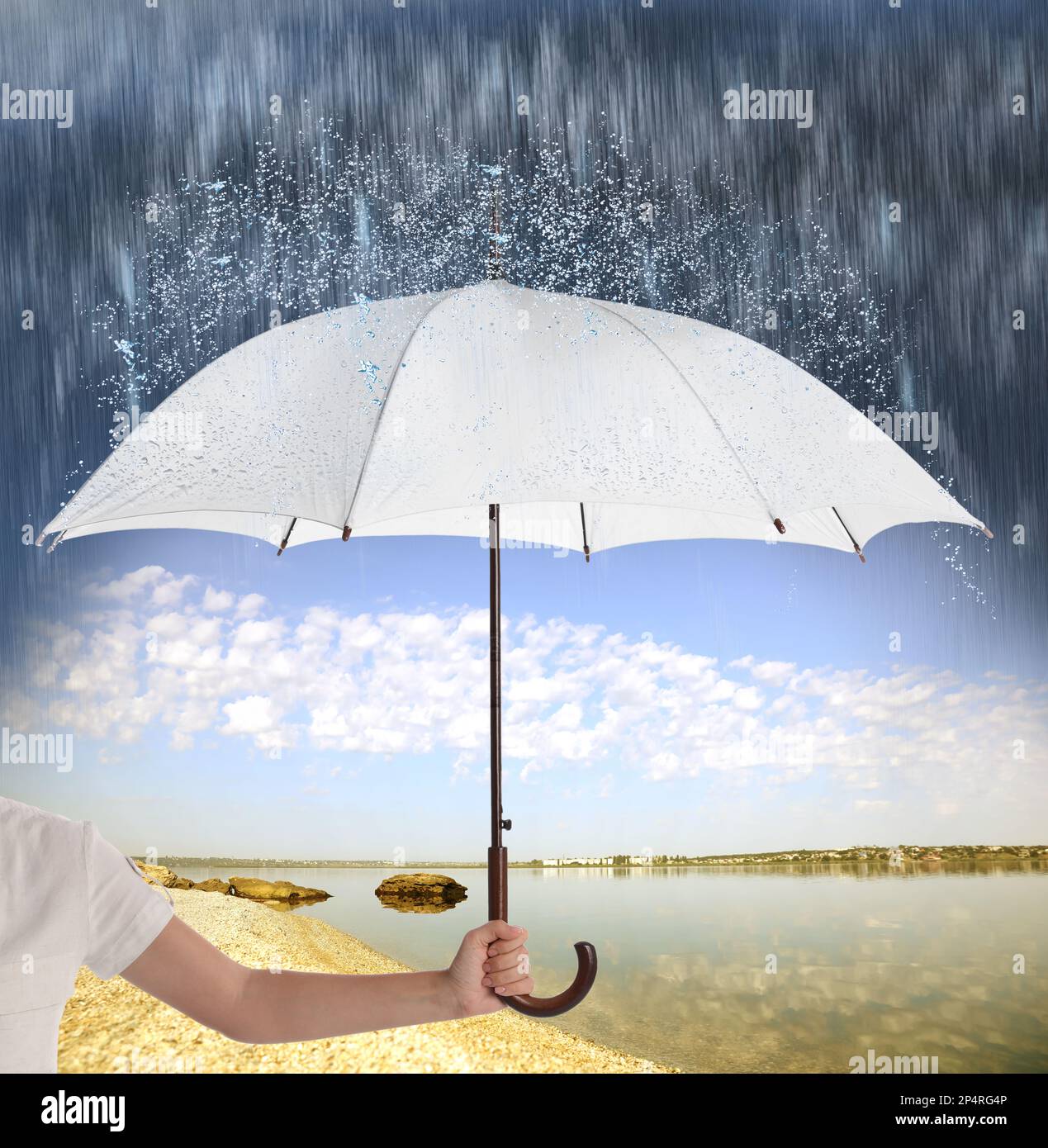 Woman beach umbrella rain hi-res stock photography and images - Alamy