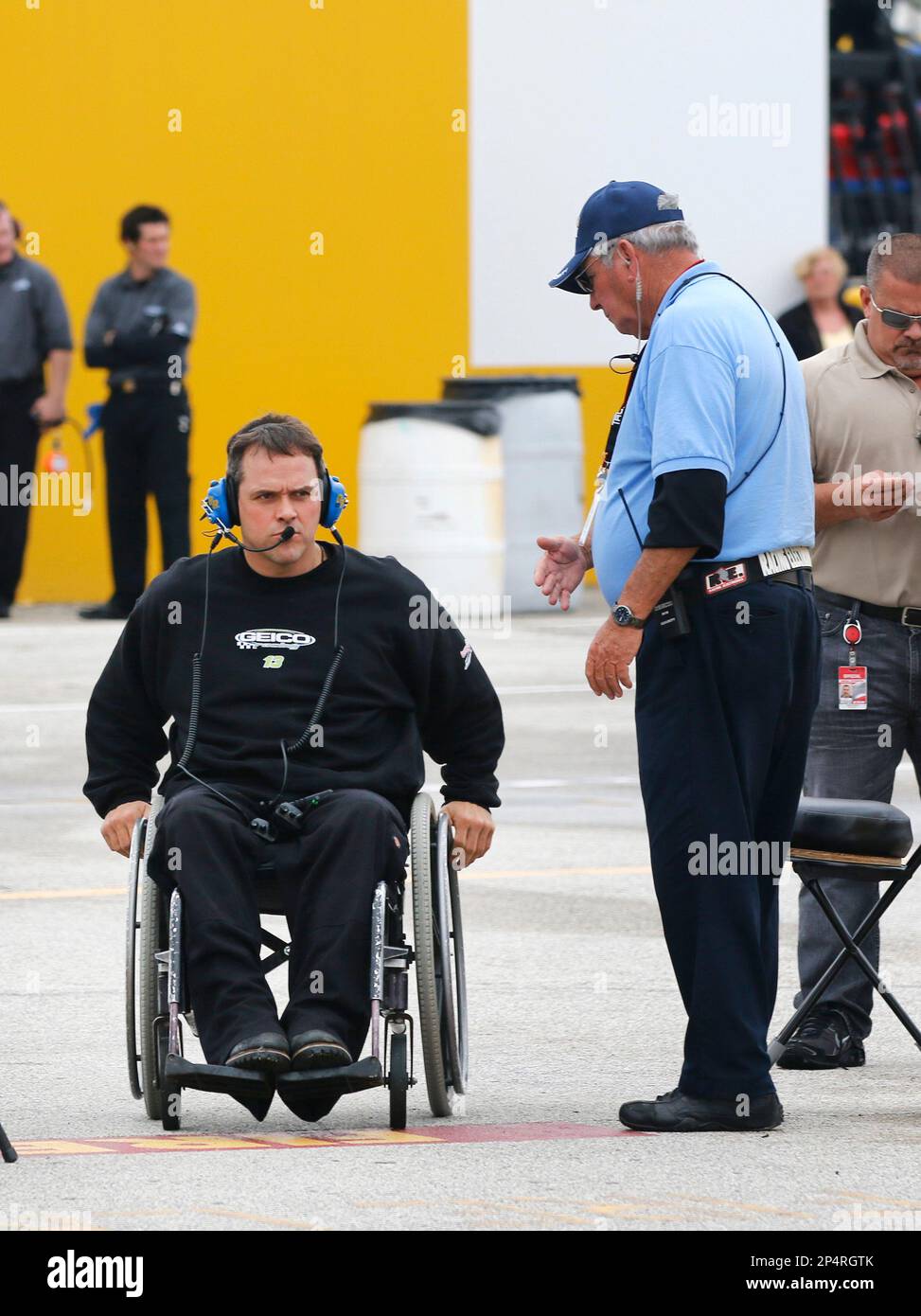 NASCAR Crew chief Robert "Bootie" Barker, left, oin the garage area ...