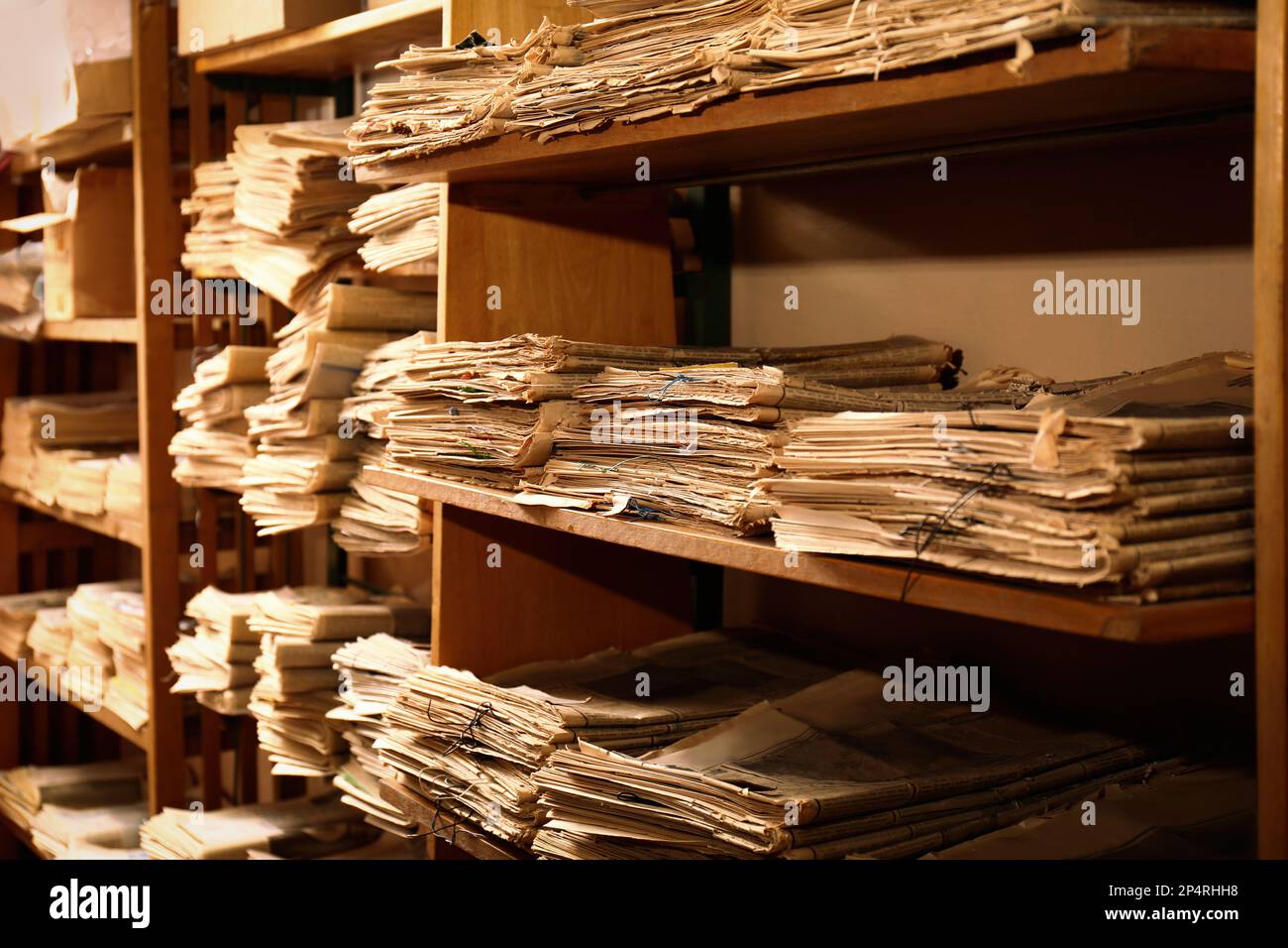 Collection of old newspapers on shelves in library Stock Photo - Alamy