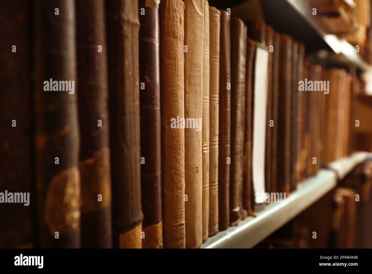 Old books on shelf in library, closeup Stock Photo - Alamy