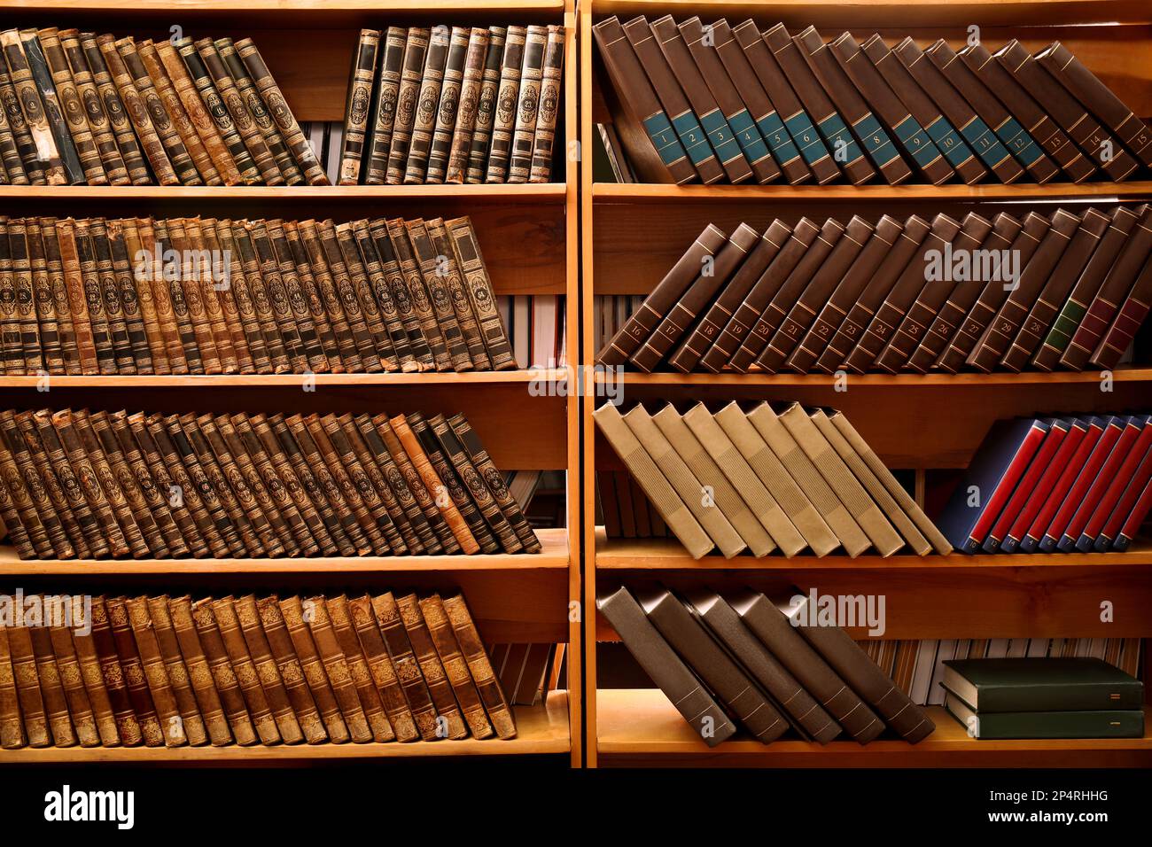 Collection of different books on shelves in library Stock Photo - Alamy