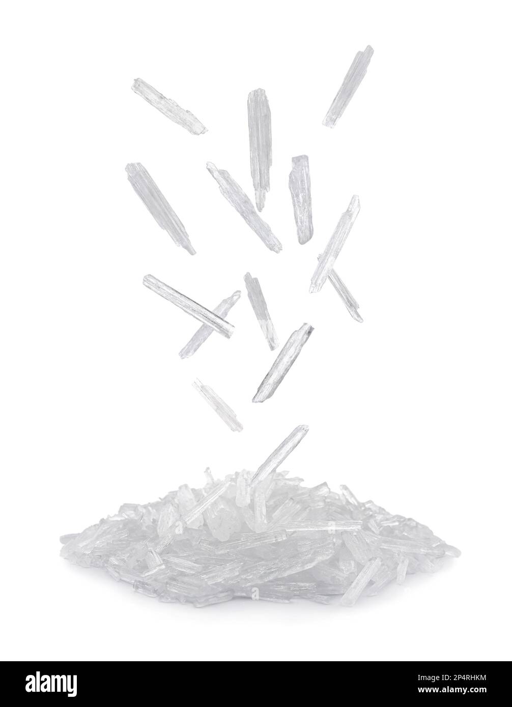 Translucent menthol crystals falling into pile on white background ...
