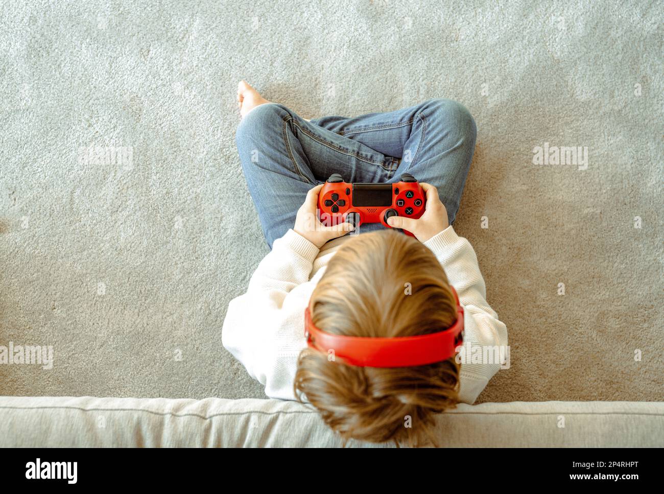 Little boy playing video game console using joystick or controller ...