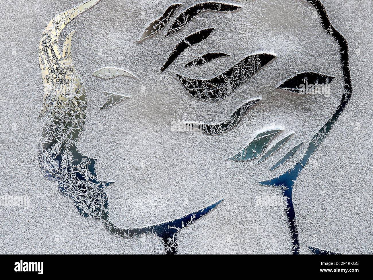 Ice crystals form on the outside glass of a dancing figure etched into ...