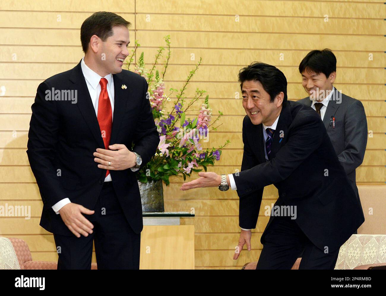 U.S. Sen. Marco Rubio, R-Fla., left, is greeted by Japanese Prime Minister Shinzo Abe, right ...