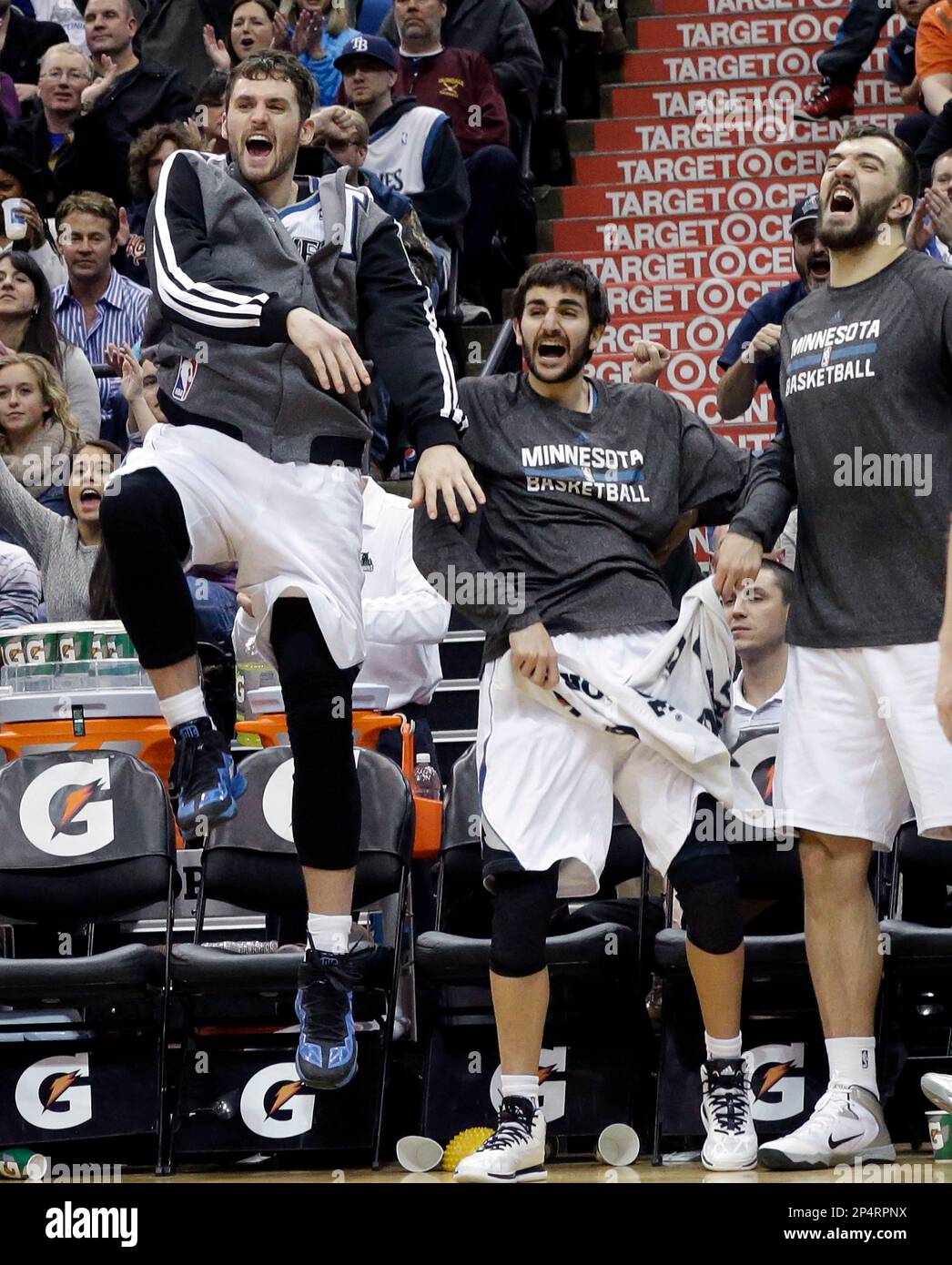 Minnesota Timberwolves' Kevin Love, left, Ricky Rubio, center, and ...
