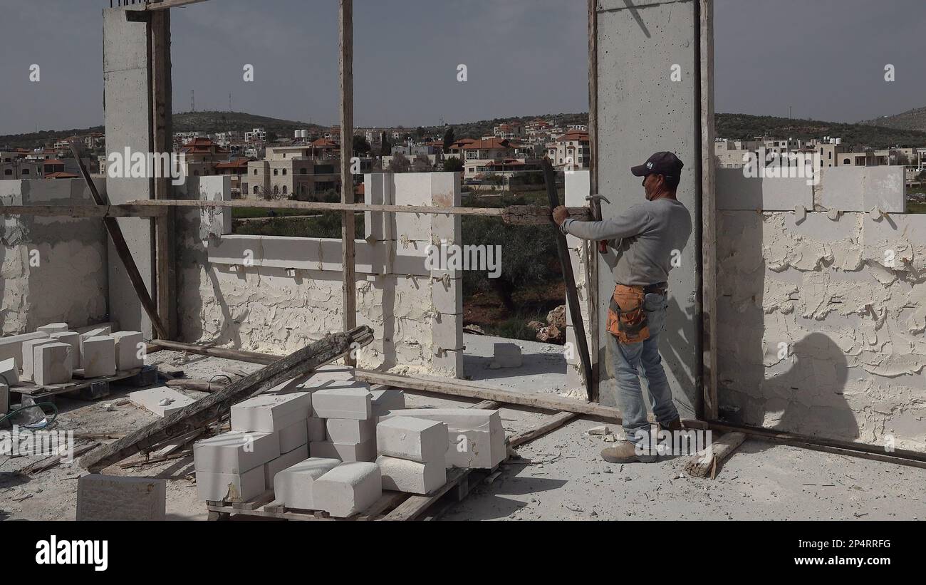 TURMUS AYYA, ISRAEL - MARCH 5: A Palestinian labourer works at the ...