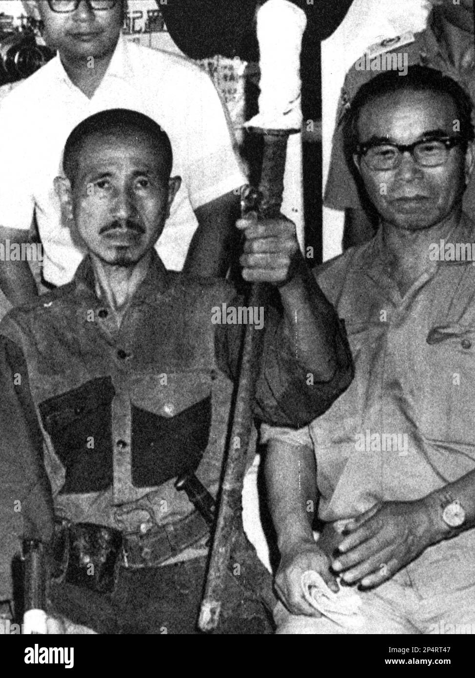 File- Former Imperial Japanese Army officer Hiroo Onoda (L) shows his ...