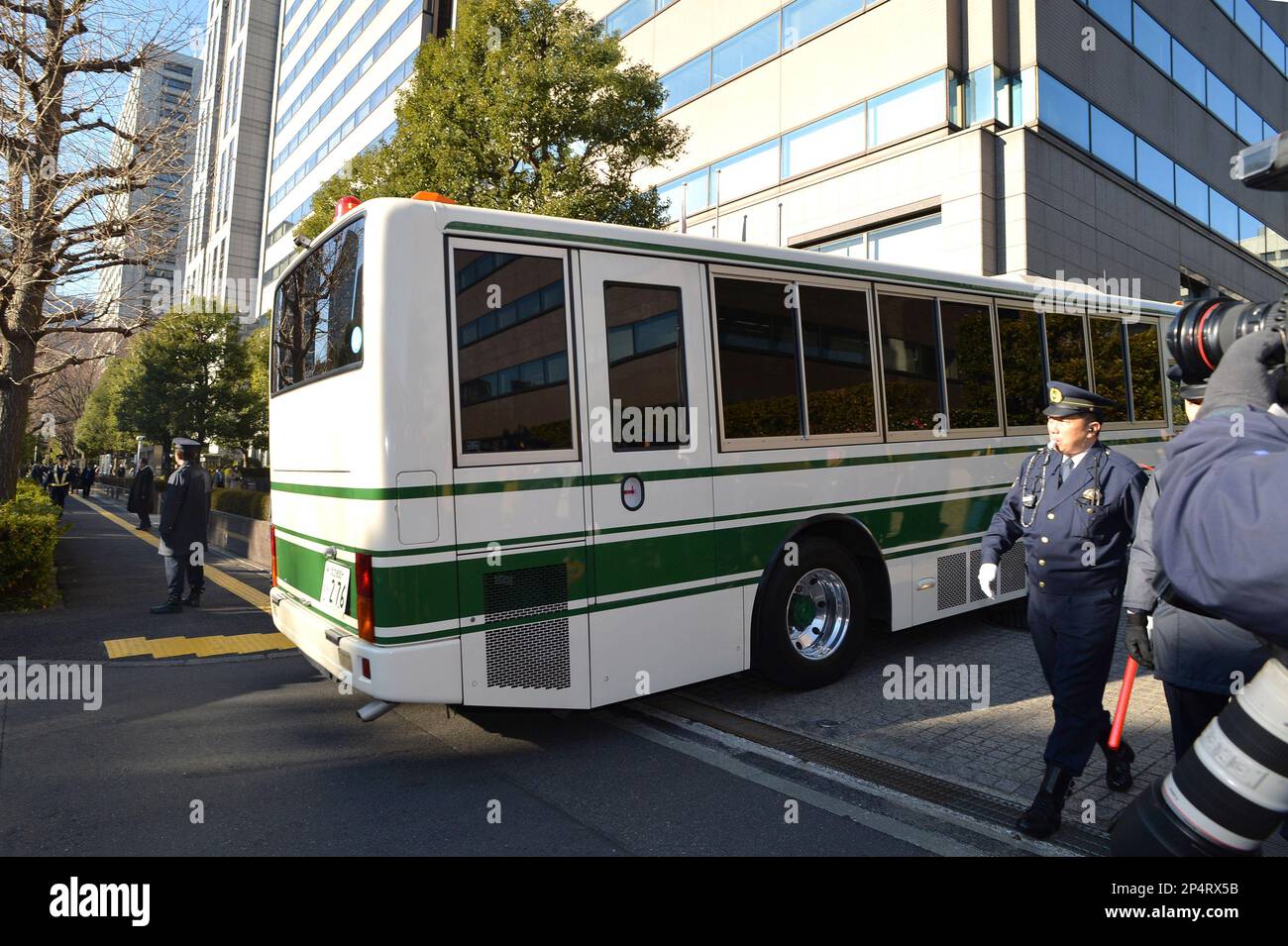 A prison bus, which is believed to carry Makoto Hirata, a former ...