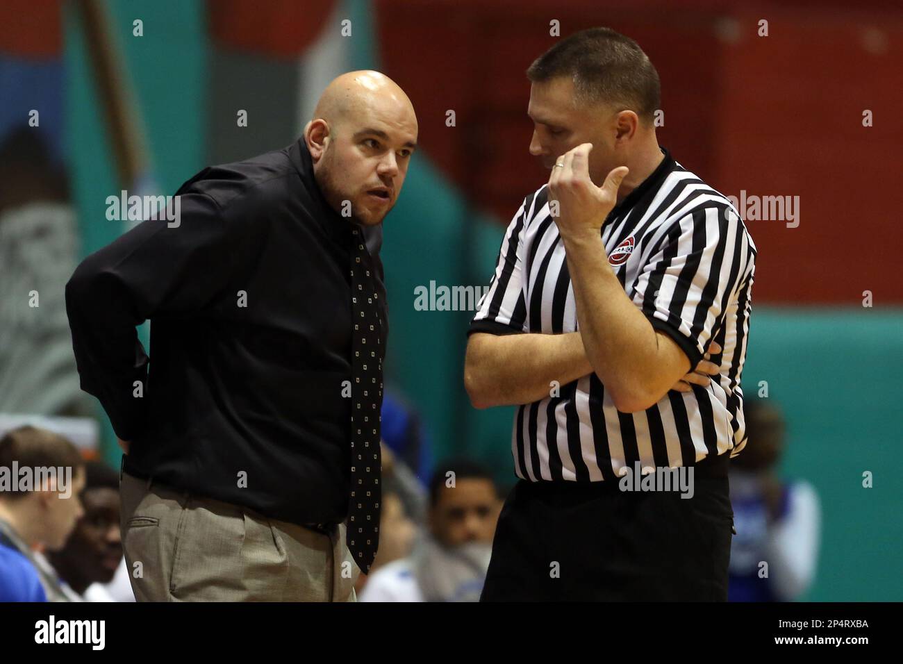 Saunders Blue Devils coach Anthony Nicodemo is seen with a ref during a ...