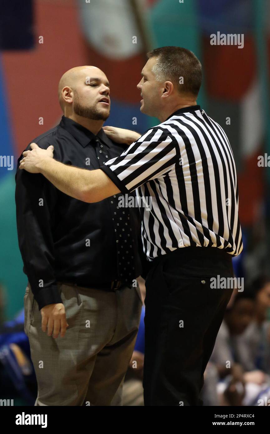 Saunders Blue Devils coach Anthony Nicodemo is seen with a ref during a ...