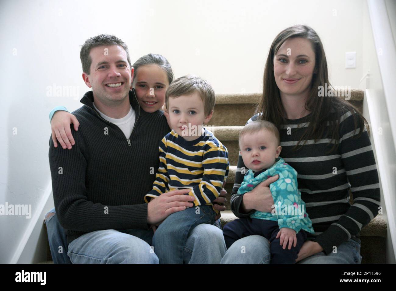 In this Jan. 7, 2014 photo, Ken Sullivan, left, poses with his family ...