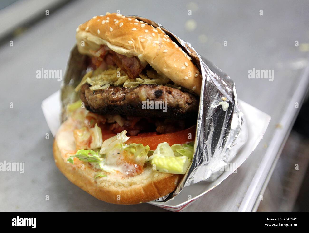This Dec. 28, 2013 photo shows a Paisa Burger, from the menu at the ...