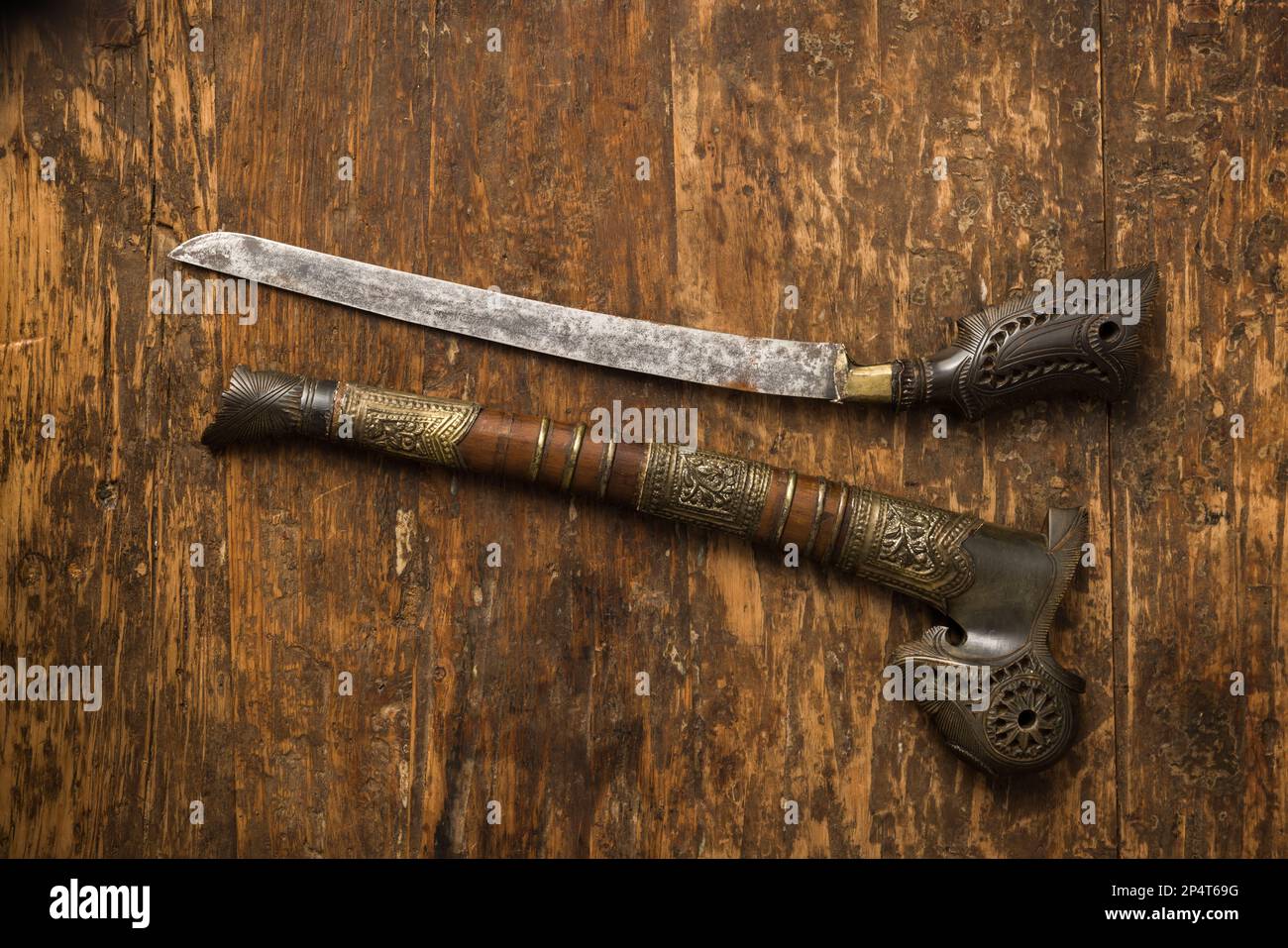 Ornately carved Tumbuk Lada dagger from the 19th century. It's a steel ...