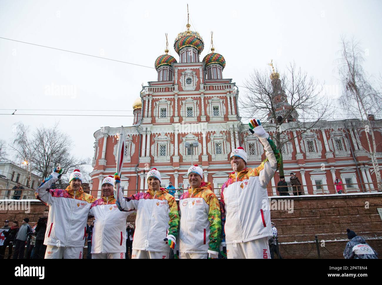 In this photo provided by Olympictorch2014.com, Olympic torch bearers from left to right ...