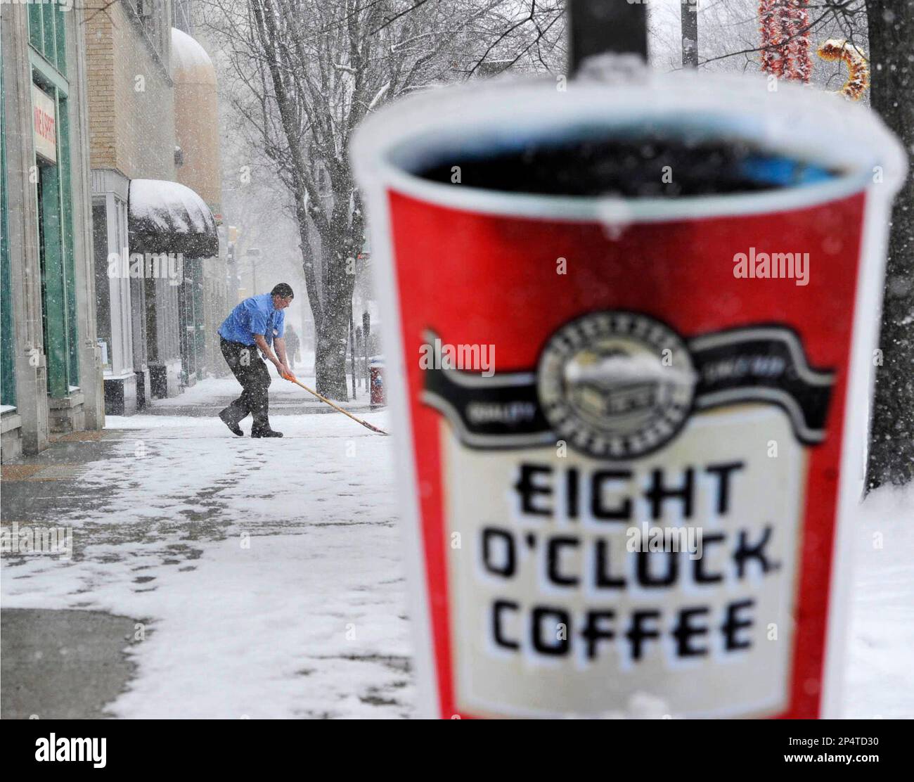 Pennsylvania State store general manager Keith Poplinski, left, shovels ...