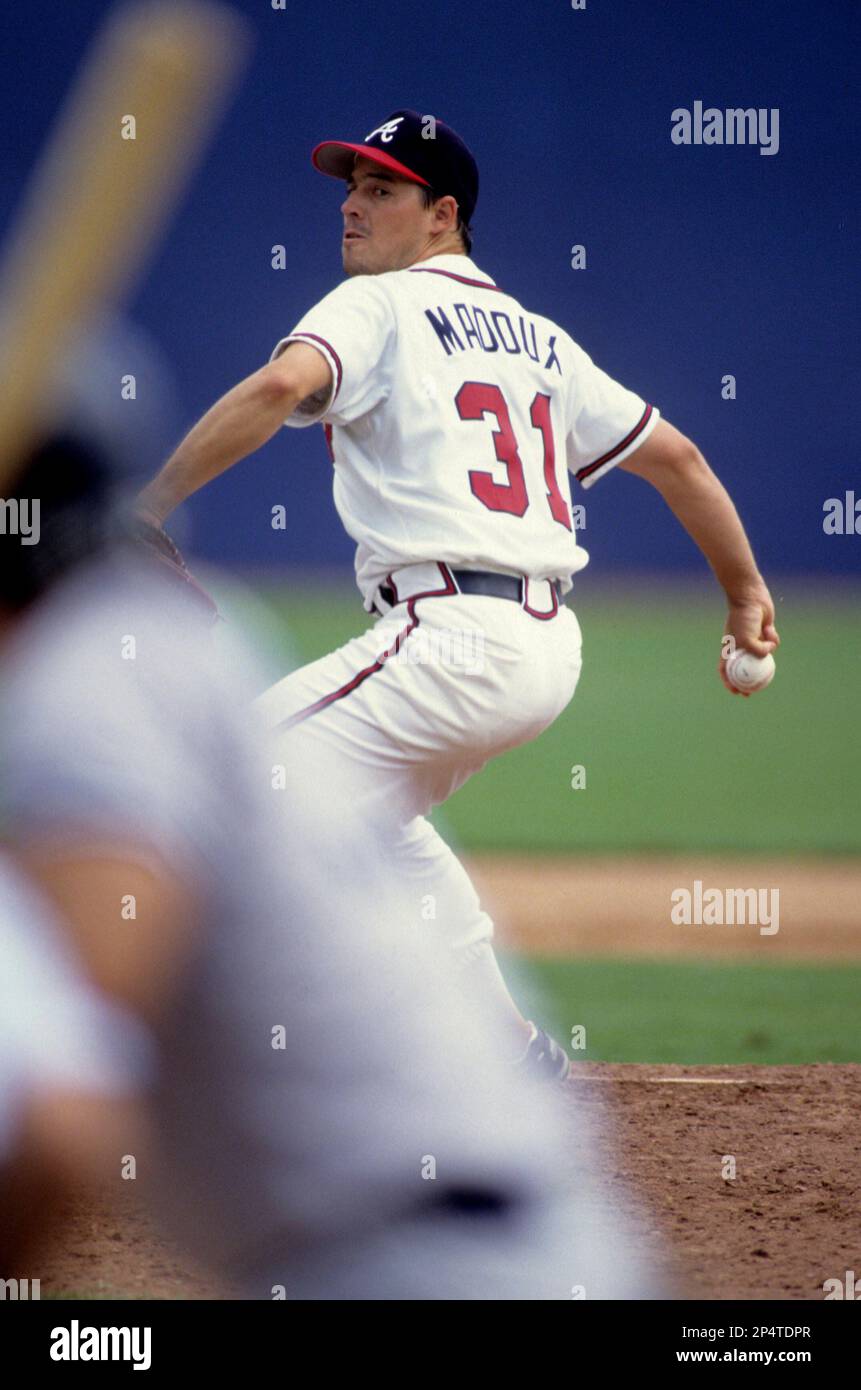 Atlanta Braves pitcher Greg Maddux pitches during a game. Circa Braves (93-03) (AP Photo/Tom ...