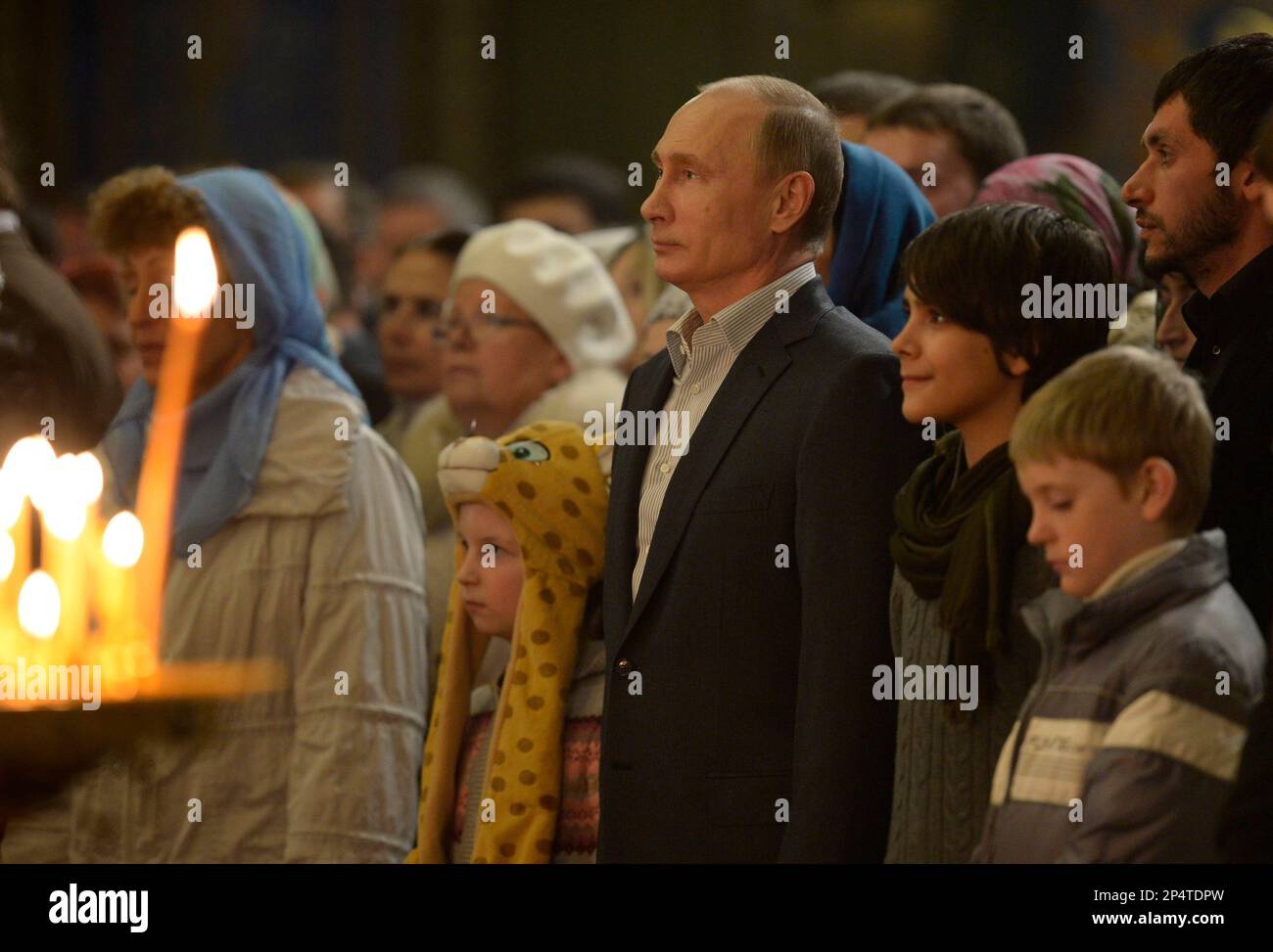 Russia's President Vladimir Putin, center, attends the Orthodox ...