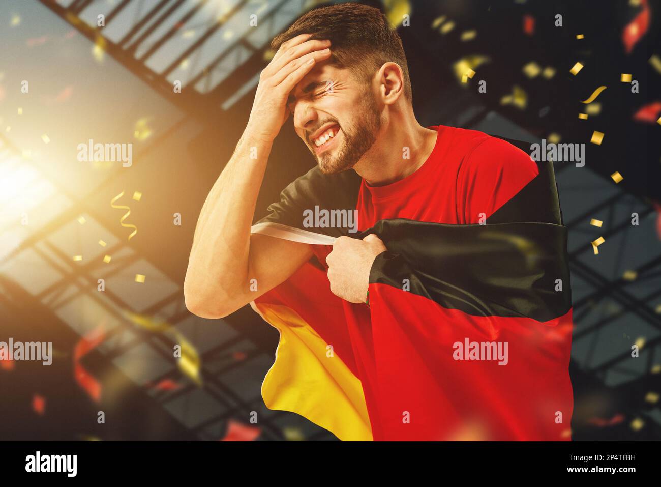Losing game. Young man, football fan with german flag cheering up ...