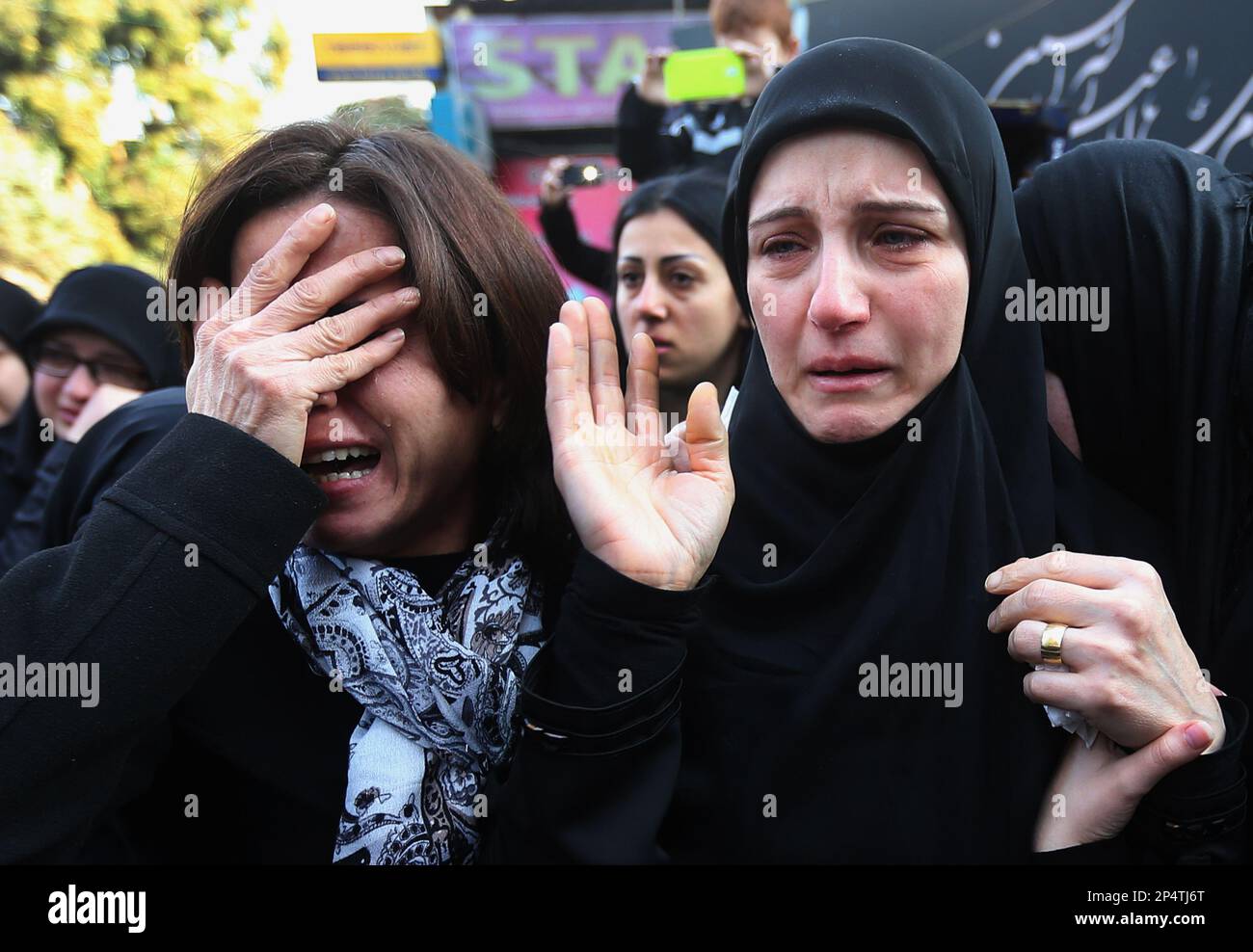 The mother of Ali Khadra, right, who was killed Thursday by a bomb ...