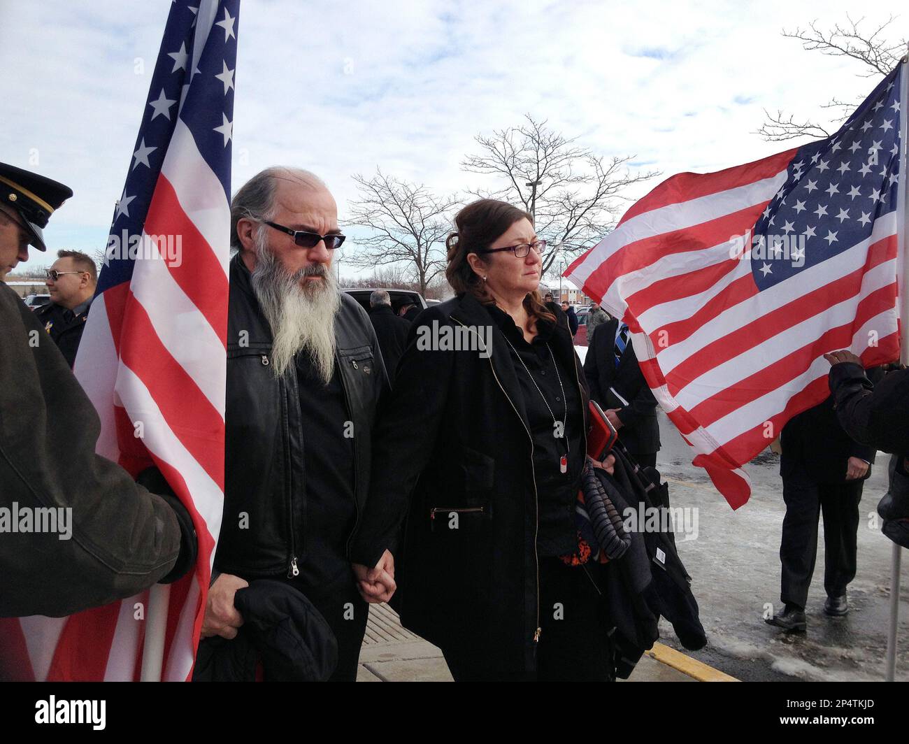 Jesse Williams' mother Debbie Bussard Passerallo, right, walks with her ...