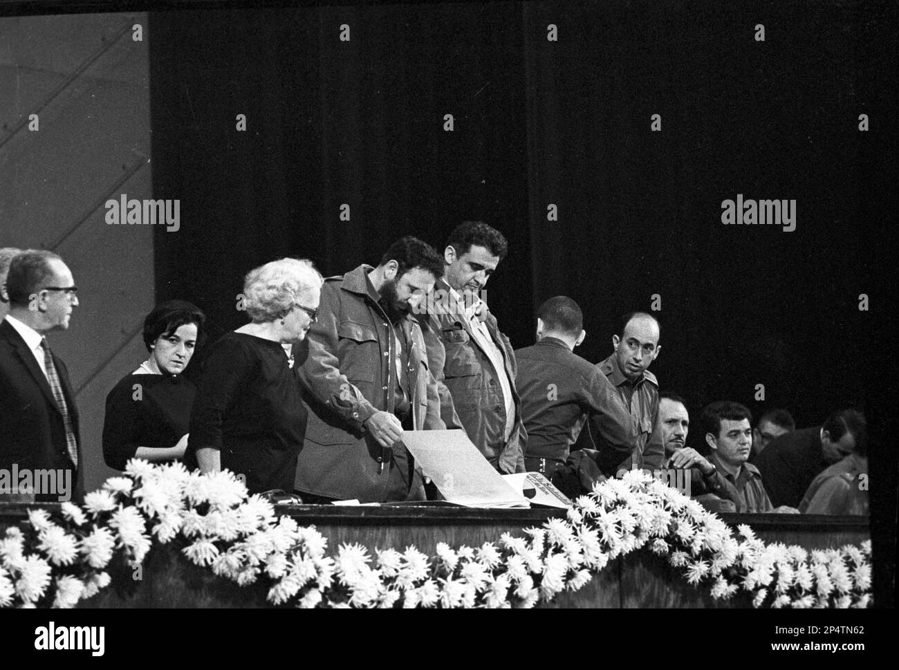 Cuban President Fidel Castro assists the first joint graduating class ...
