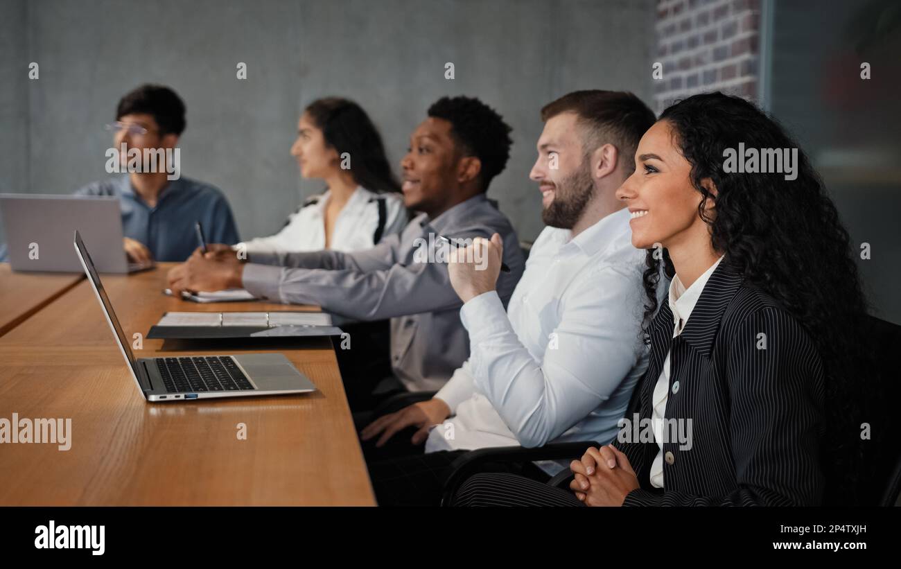 Multiracial office workers watching presentation webinar online video ...