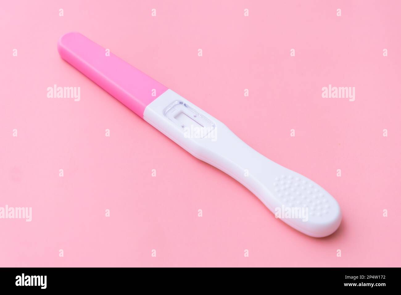 Pregnancy test isolated on the pink background Stock Photo - Alamy
