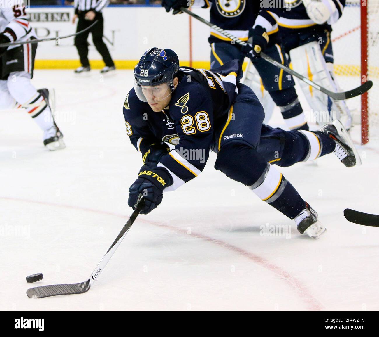 St. Louis Blues defenseman Ian Cole lunges after the puck in second ...