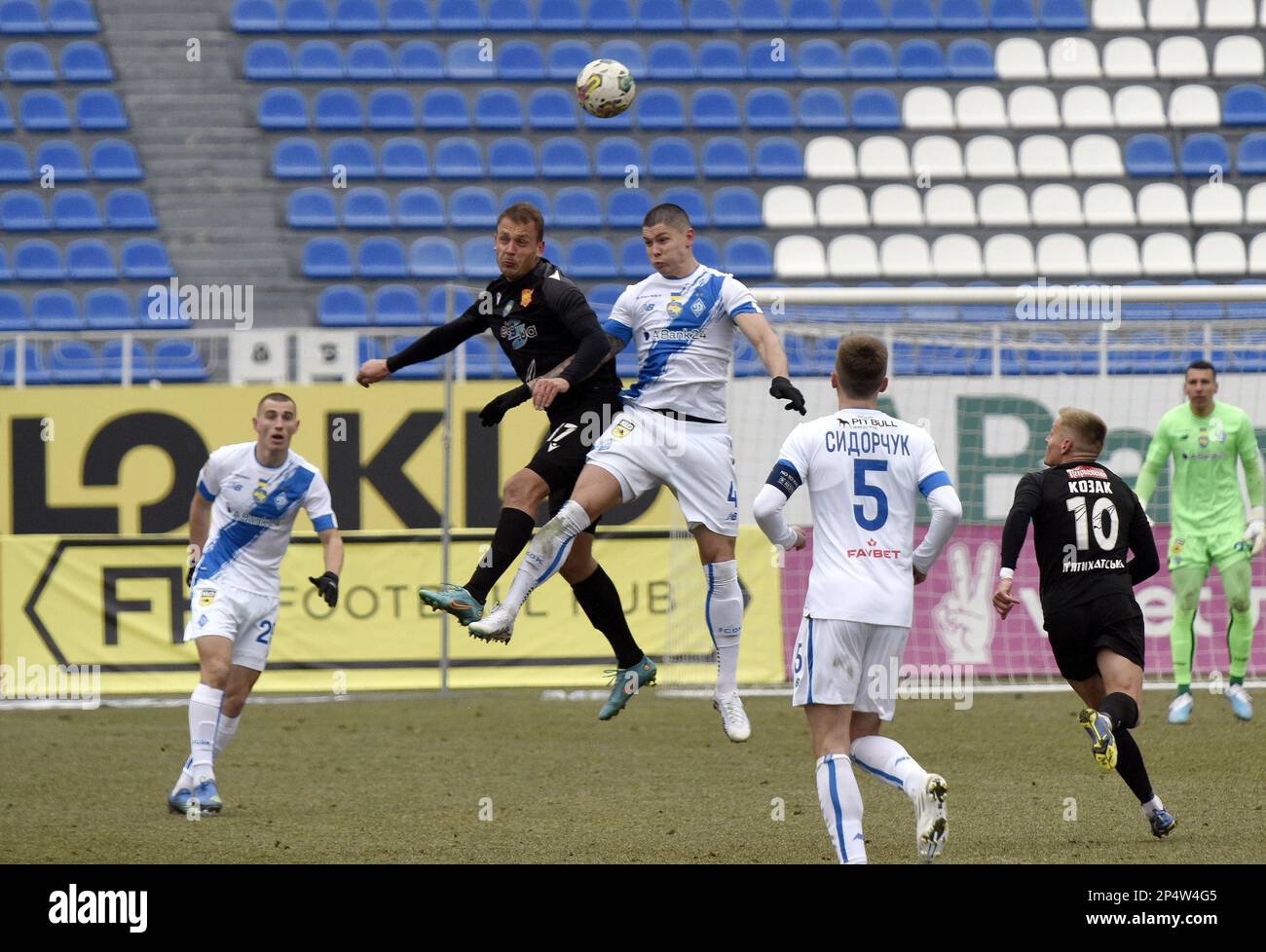 KYIV, UKRAINE - MARCH 4, 2023 - Players of FC Dynamo Kyiv (white kit ...