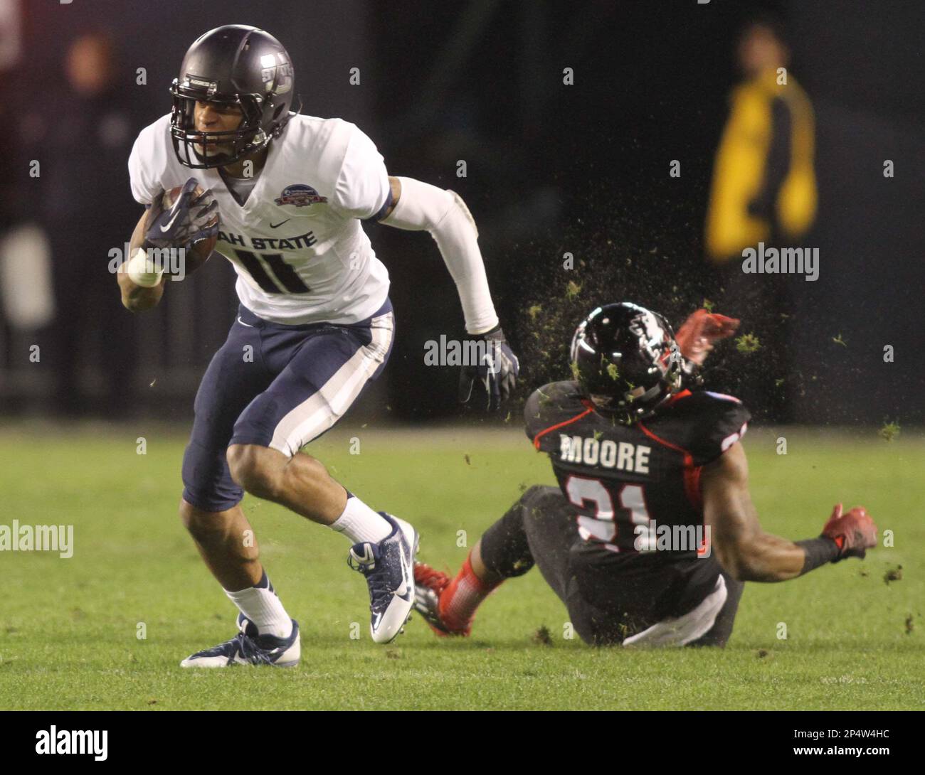 Utah State Aggie Brandon Swindall (11) makes a play with the football ...