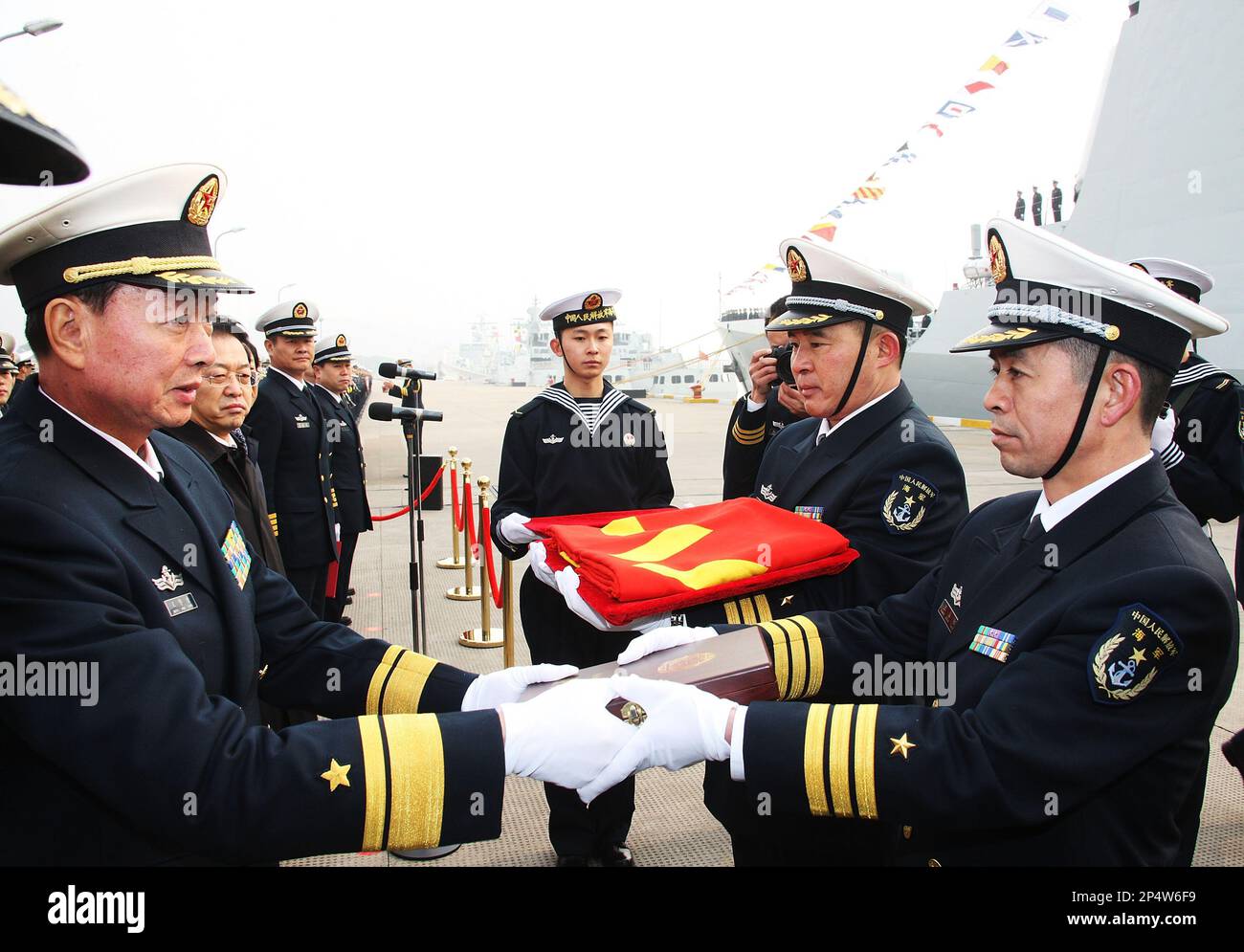 Wang Chunyang (R), political commissar of the new China-made Type 052C ...