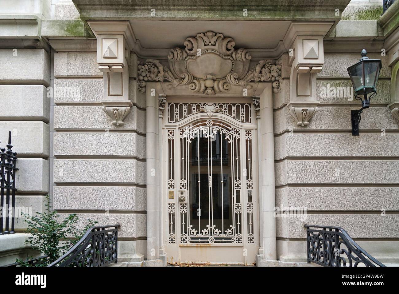 Manhattan, elegant townhouse entrance with ornate wrought iron grill on ...