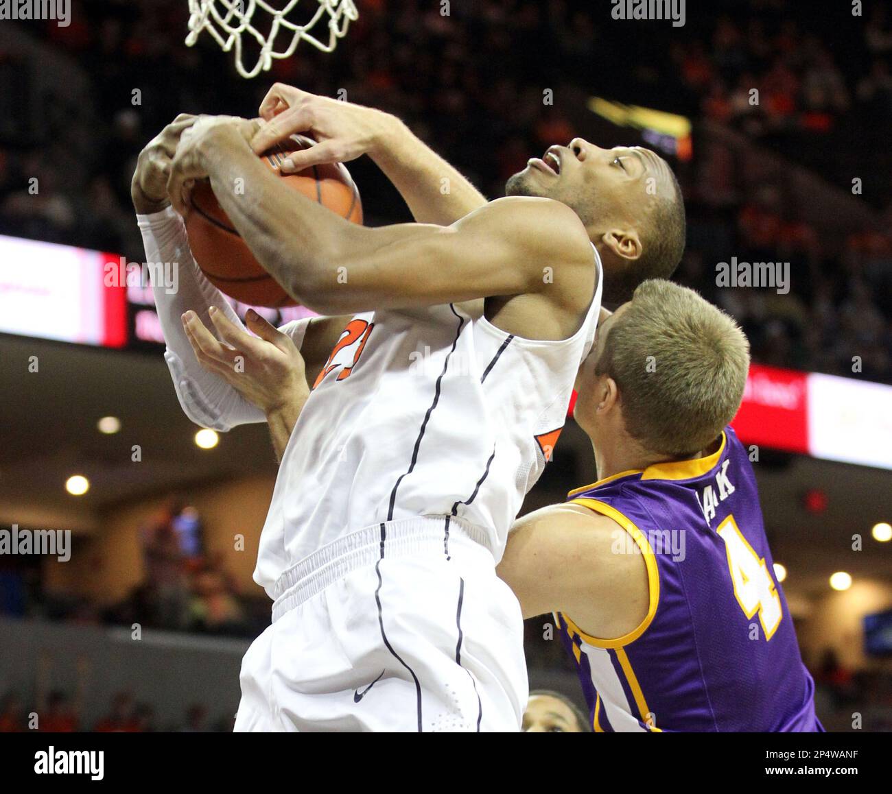 Virginia forward Akil Mitchell (25) is fouled by Northern Iowa forward ...