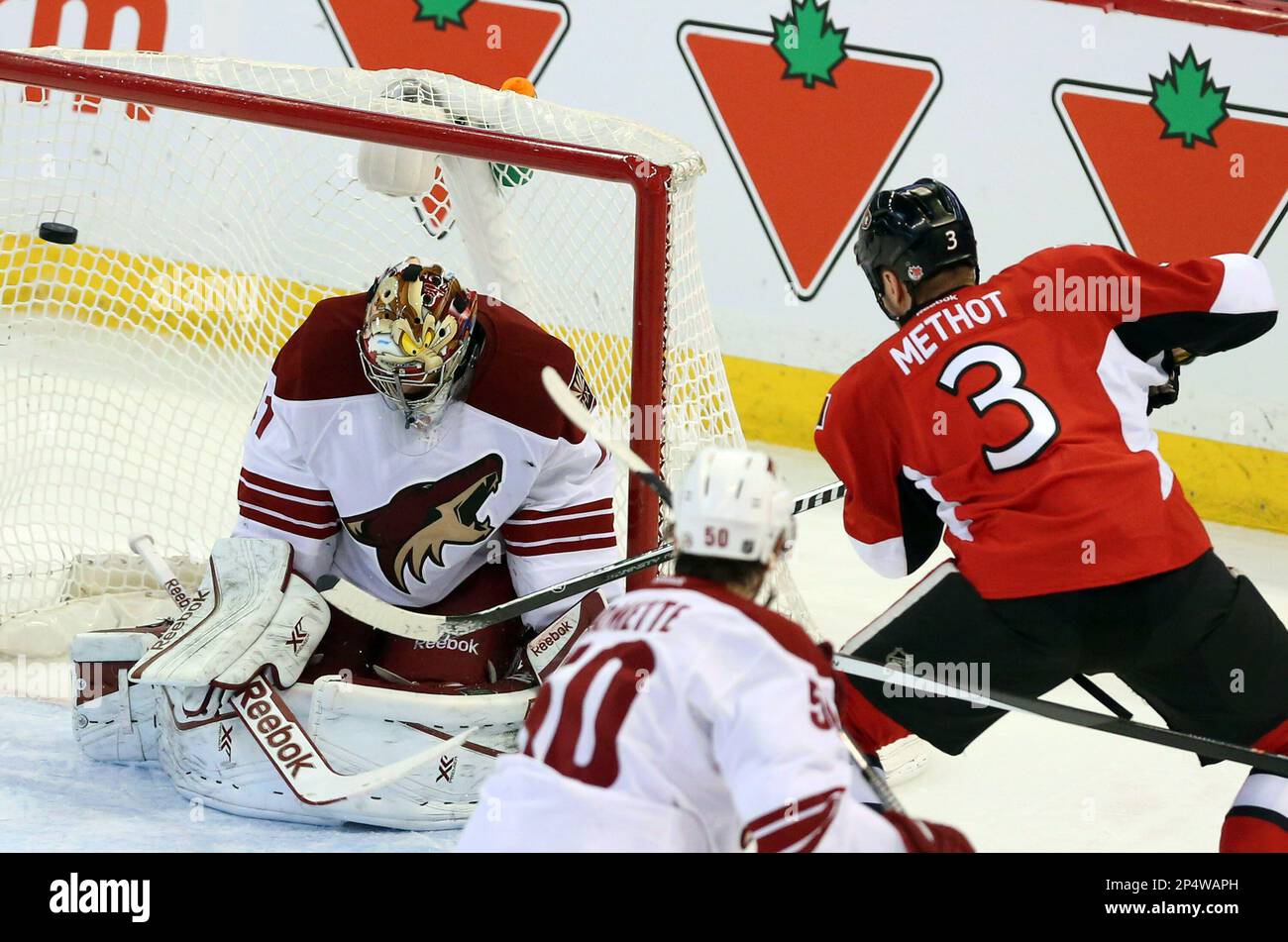 Ottawa Senators Marc Methot (3) fires the puck past Phoenix Coyotes ...
