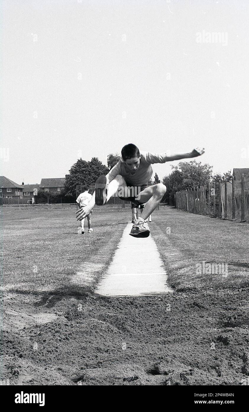 1989, historical, secondary school sports day, front view of a male ...