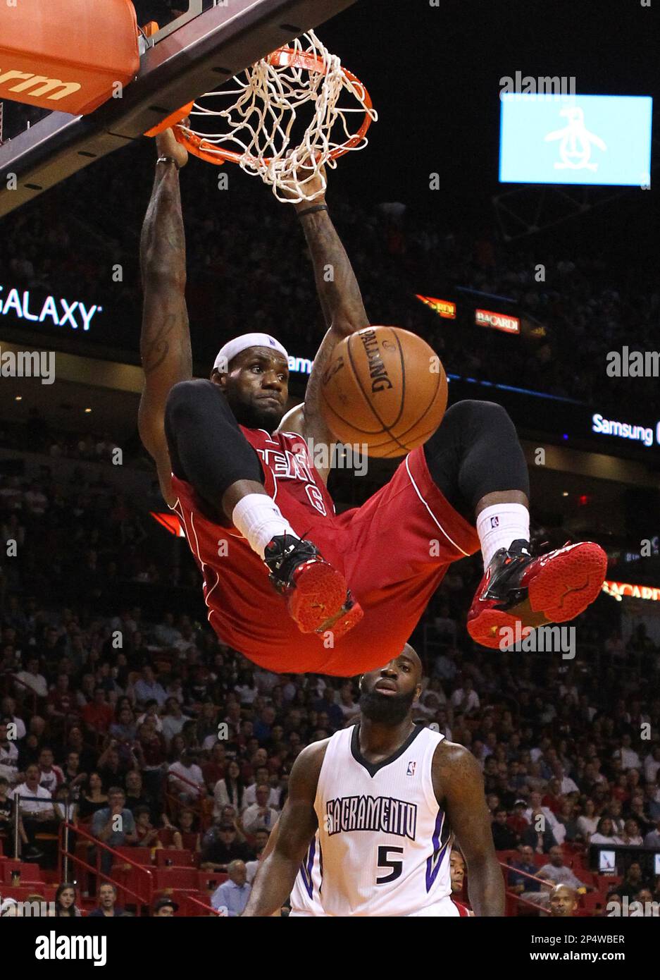 Miami Heat forward LeBron James, top, dunks in front of Sacramento ...