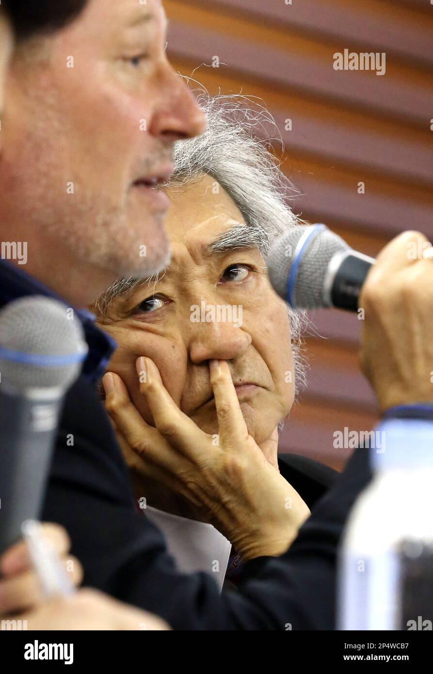Japanese renowned conductor Seiji Ozawa watches and hears stage ...