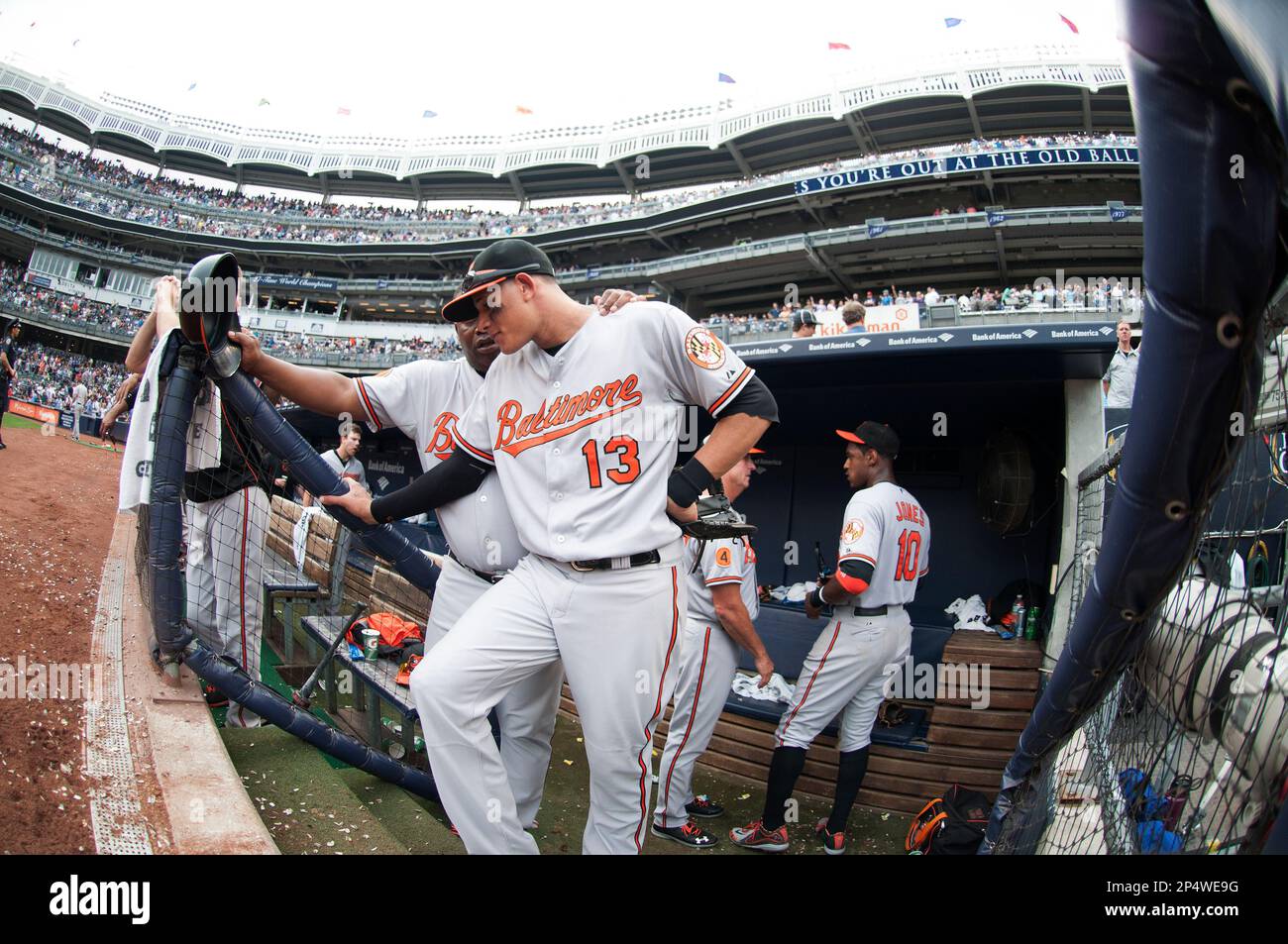 Baltimore Orioles infielder Manny Machado (13) and coach Wayne Kirby ...